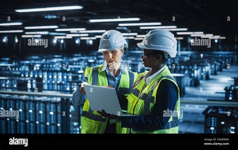 Data Center It Specialist And System Administrator Talk Use Laptop Computer Wearing Safety