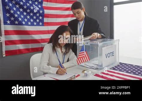 Two Women Overseeing The Voting Process In An American Electoral Room