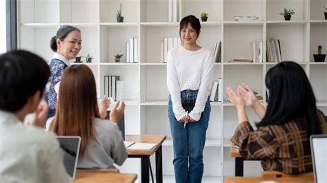 Teacher And Everyone In The Classroom Is Applauding A Student Who Is
