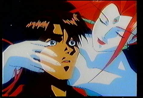 Sharon Apple With Red Hair Leaning Round Isamu With One Hand On His