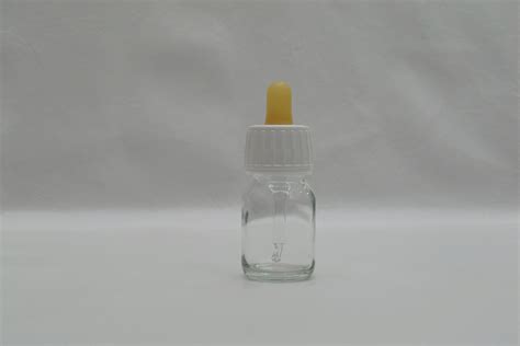 Frasco vidrio aligerado transparente Pilfer con tapón cuentagotas precintable blanco y tetina