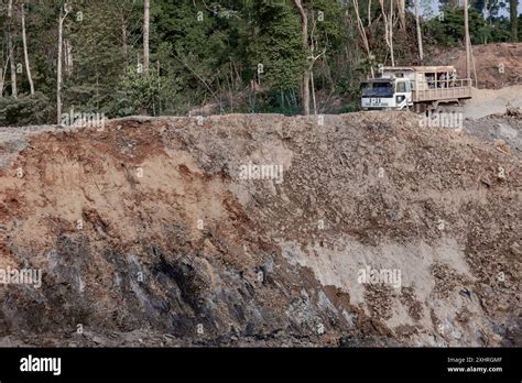 Borneo Indonesia A Truck Carrying Mine Workers Passing Through The Coal Mining Area Stock