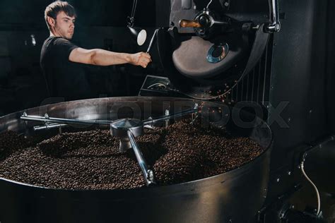Professional Male Roaster Working With Industrial Roasting Machine Stock Image Colourbox