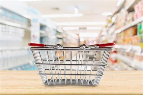 Premium Photo Empty Shopping Basket On Wood Table Over Grocery Store