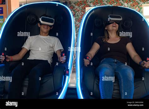 Virtual Reality Attraction Son And Mother Experience Adrenaline From