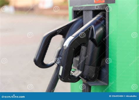 Charging Station For Electric Vehicles With Two Types Of Cables For