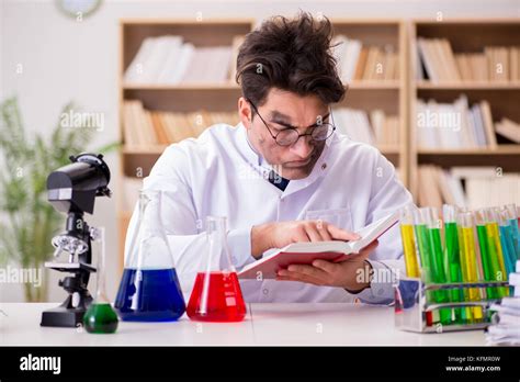 Mad Crazy Scientist Doctor Doing Experiments In A Laboratory Stock