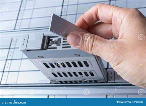 Hand Of A Technician Exchanging Hard Drive With SAS Interface In Stock