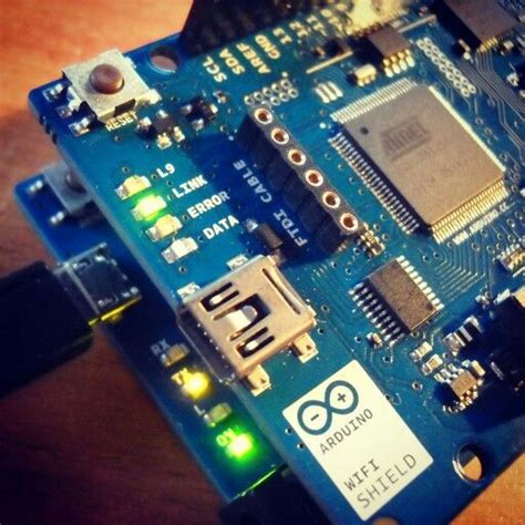 a close up of a micro board with some wires attached to it and other