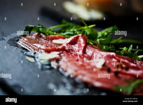 Beef Carpaccio With Rocket Olive Oil Parmesan Pepper And Salt On