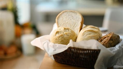 Premium Photo Fresh Homemade Bread In Basket On Wooden Table In