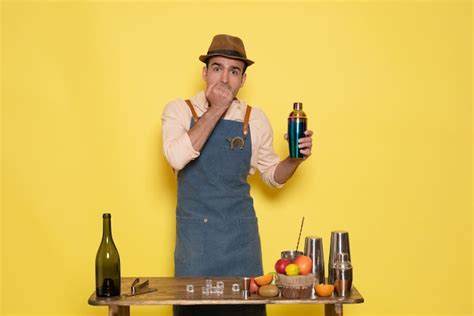 Free Photo Front View Young Male Bartender In Front Of Table With