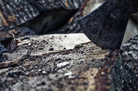 Premium Photo Close Up Of Axe On Tree Stump