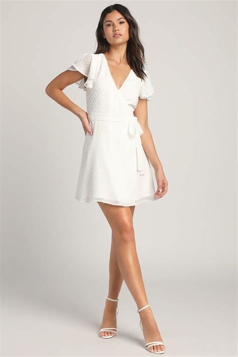 Much To Celebrate White Swiss Dot Flutter Sleeve Wrap Mini Dress Mini