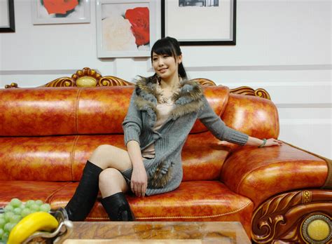 Looking Away Chinese Knee High Boots Couch Legs Crossed 1080p