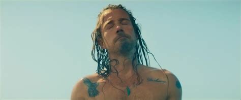 WAVES GUN AROUND AS HE GETS OUT OF WATER ThisVid