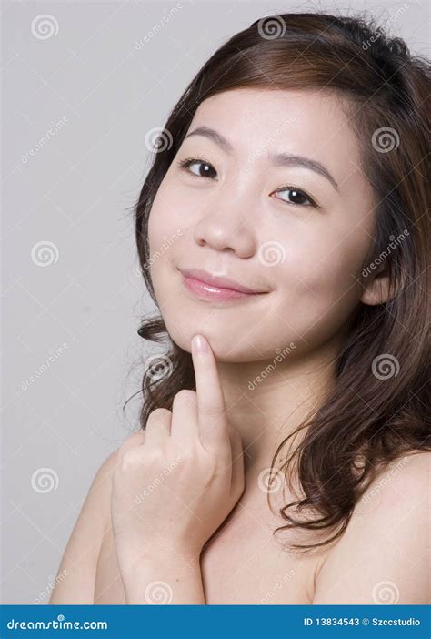 Smiling Asian Girl With A Finger Touching Her Chin Stock Image Image Of Cheerful Health 13834543