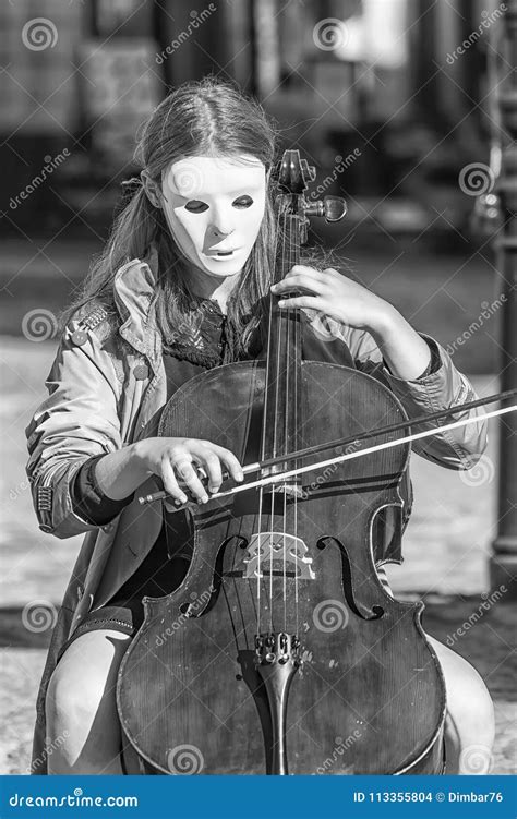 A Street Musician In A Mask Plays A Double Bass Editorial Stock Image
