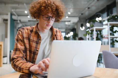 Male Programmer Wear Spectacles For Eyes Protection While Working On