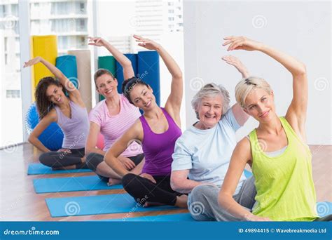 Women Practicing Stretching Exercise In Gym Class Stock Image Image Of Exercises Class 49894415