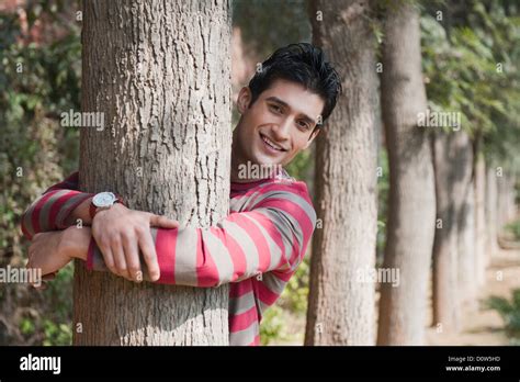 Portrait Of A Man Hugging A Tree Stock Photo Alamy