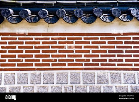 A Brick Wall With A Red Brick Border The Wall Is Made Of Bricks And Has A White Border Stock