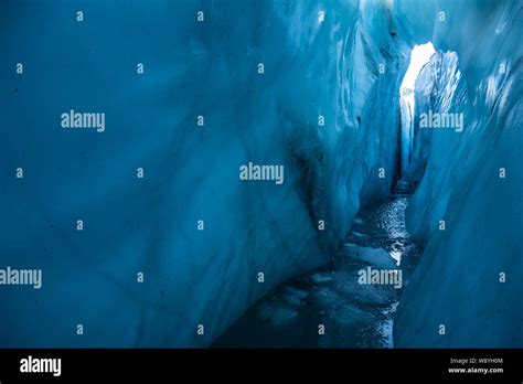 A Thin Ice Bridge Spanning A Water Filled Crevasse Looking Up At Hte