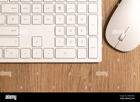 keyboard from a computer and a computer mouse on a desk in the office