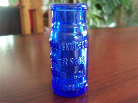 Antique Small Blue Glass Bottle Embossed Lettering Bromo