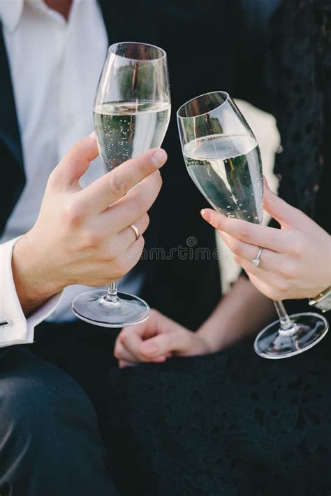 Hands Of Elegant Man And Woman Cheering With Glasses Stock Image