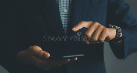 Businessman Holding A Smartphone Technology Iot Internet Of Things