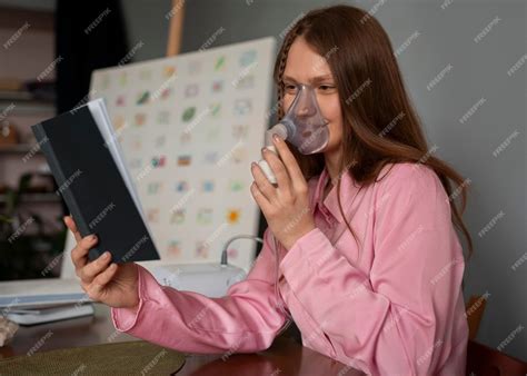Free Photo Medium Shot Woman Using Nebulizer At Home