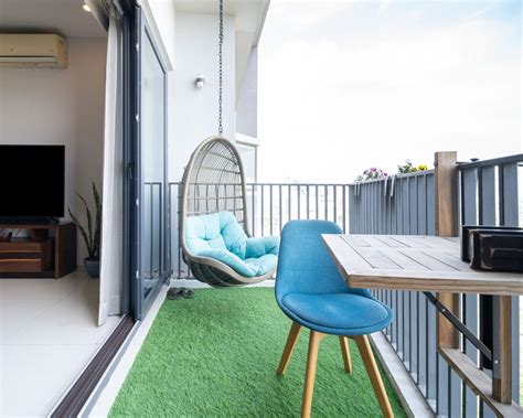 Balcony Design With A Swing And A Cushioned Blue Chair Livspace