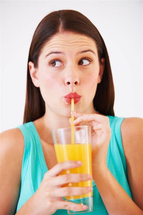 This Orange Juice Is Really Good An Attractive Young Woman Looking