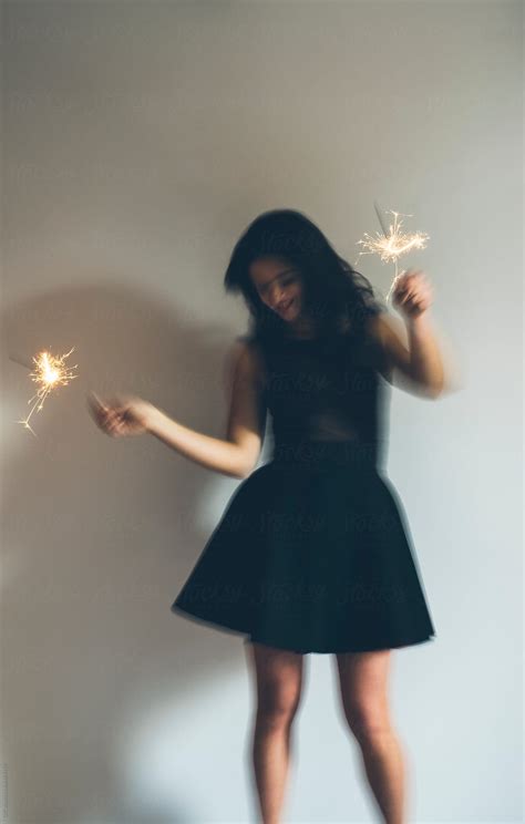 Woman Holding Sparkler During A Party By Stocksy Contributor Simone