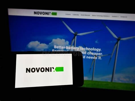 Person Holding Smartphone With Logo Of Australian Battery Company