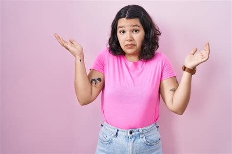 Premium Photo Young Hispanic Woman Standing Over Pink Background