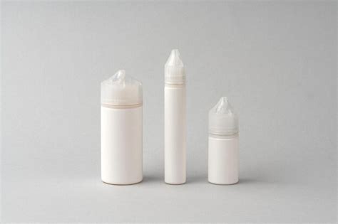 Premium Photo Refill Liquid For Electronic Cigarettes On Gray Background