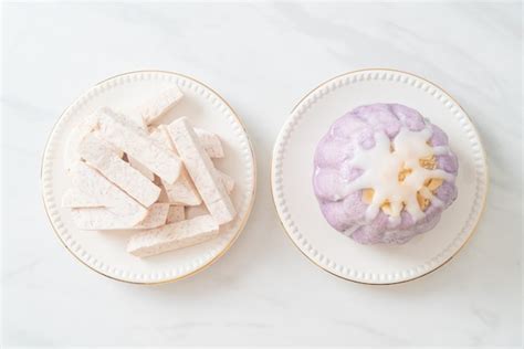 Premium Photo Taro Bun With White Sugar Cream And Nut On Top