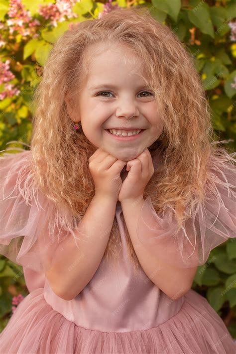 Premium Photo Portrait Of A Beautiful Blonde Girl In A Pink Dress