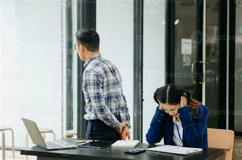 Furious Two Asian Businesspeople Arguing Strongly After Making A