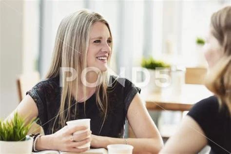A Mature Christian Woman Mentoring And Having A Bible Study With A