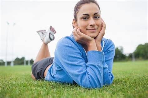 Premium Photo Pretty Young Woman Lying On The Grass