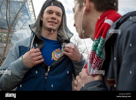 A fan of the Russian CSKA football club shows the club's logo to the ...