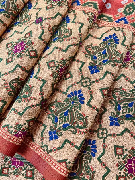 Light Carrot Color Banarasi Dupion Silk Bandhej Bandhani Saree Minakari And Muted Gold Zari