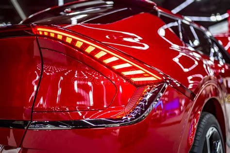 Led Rear Lights Of A Bright Red Electric Car With Reflection Lamp