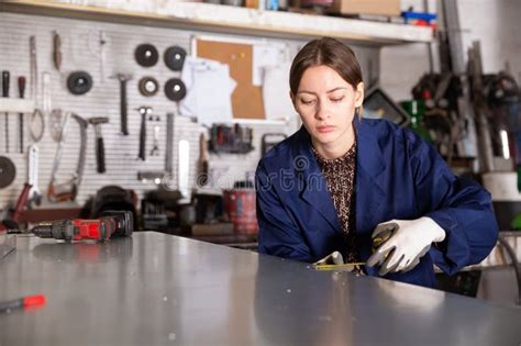 Craftswoman Measuring Metal Structures In Workshop Stock Image Image