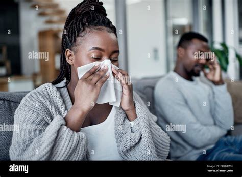 Ill Share Anything With You Except The Flu A Young Woman Blowing Her