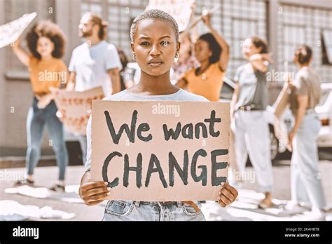 Black Woman Protest Group And Sign About Peace Justice And Gender