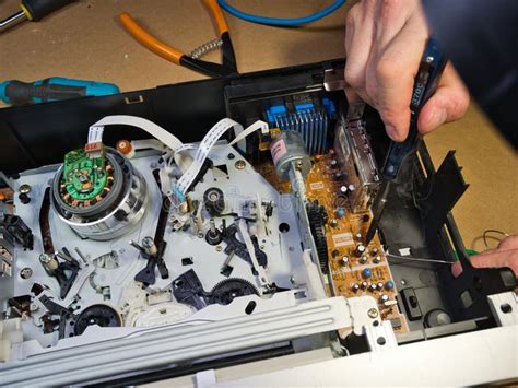 Vcr Repair And Maintenance With Vhs Tape Overhead View Of A Technician